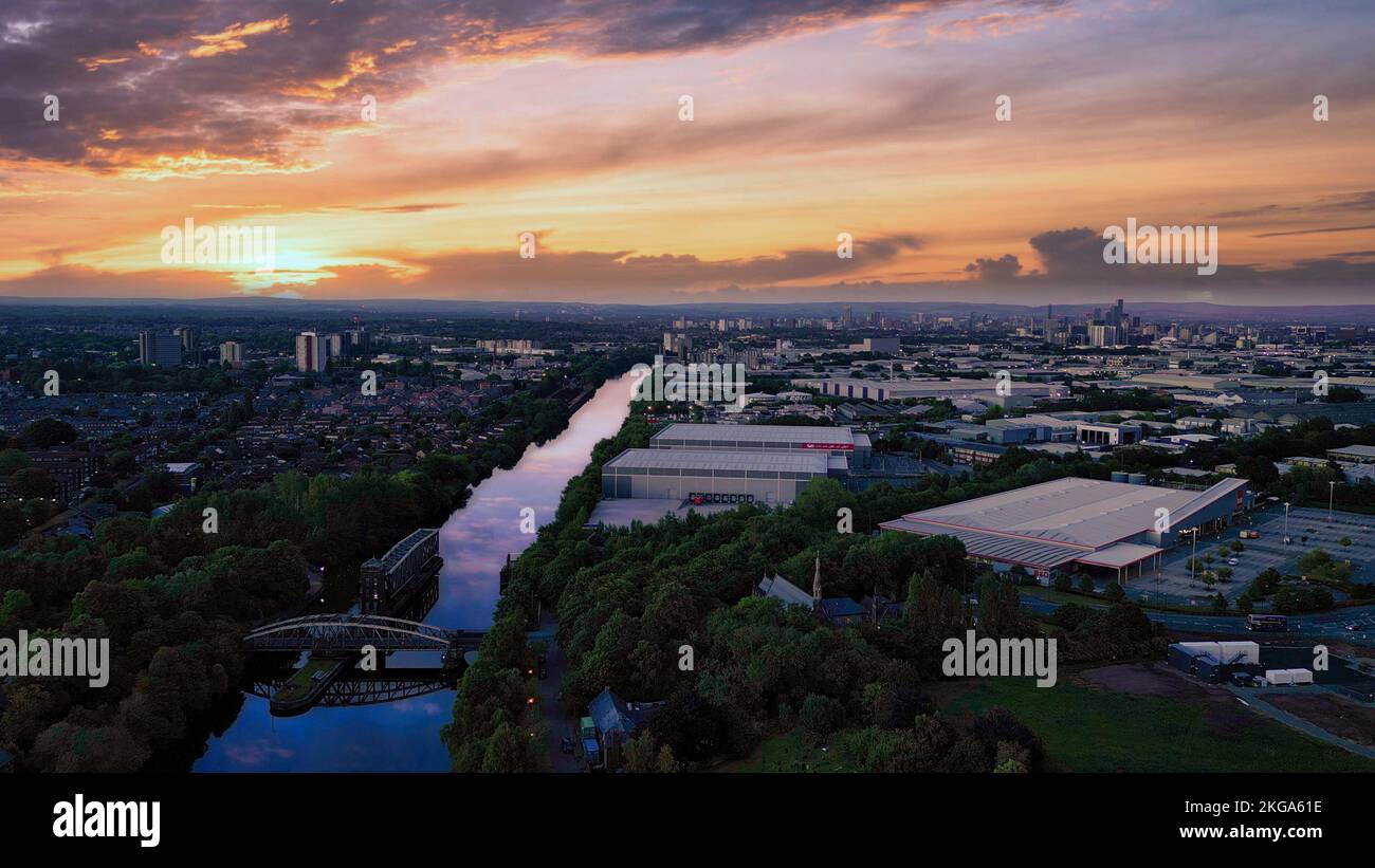 An aerial view of the Manchester cityscape during an orange sunrise ...