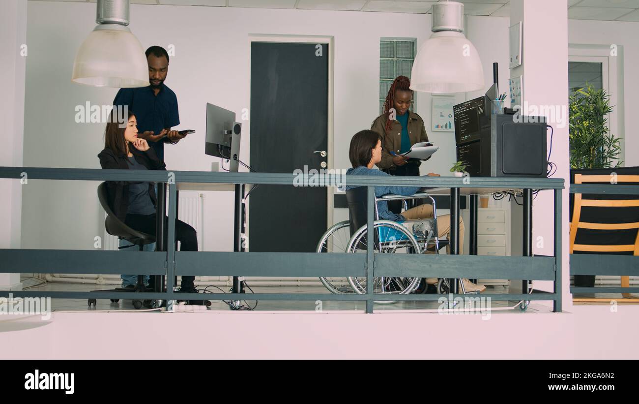 Multiethnic Group Of Programmers Collaborating On It Project To Create Algorithm For New Cloud