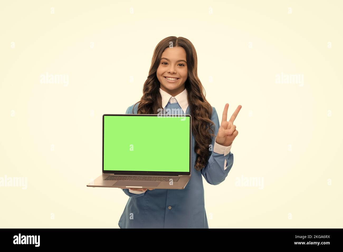 happy face of teen girl with long curly hair show computer isolated on ...