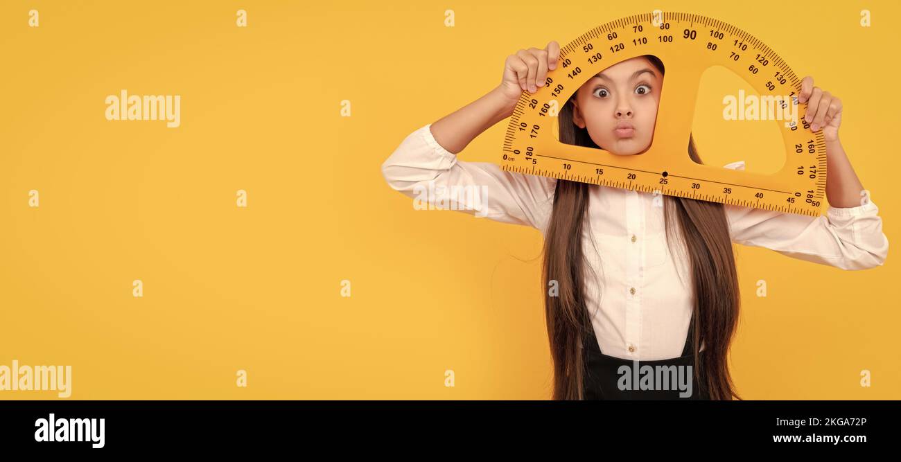 funny teen girl in school uniform hold mathematics protractor for ...