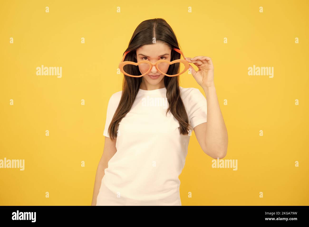 Surprised woman, shocking girl wearing funny glasses on isolated yellow ...