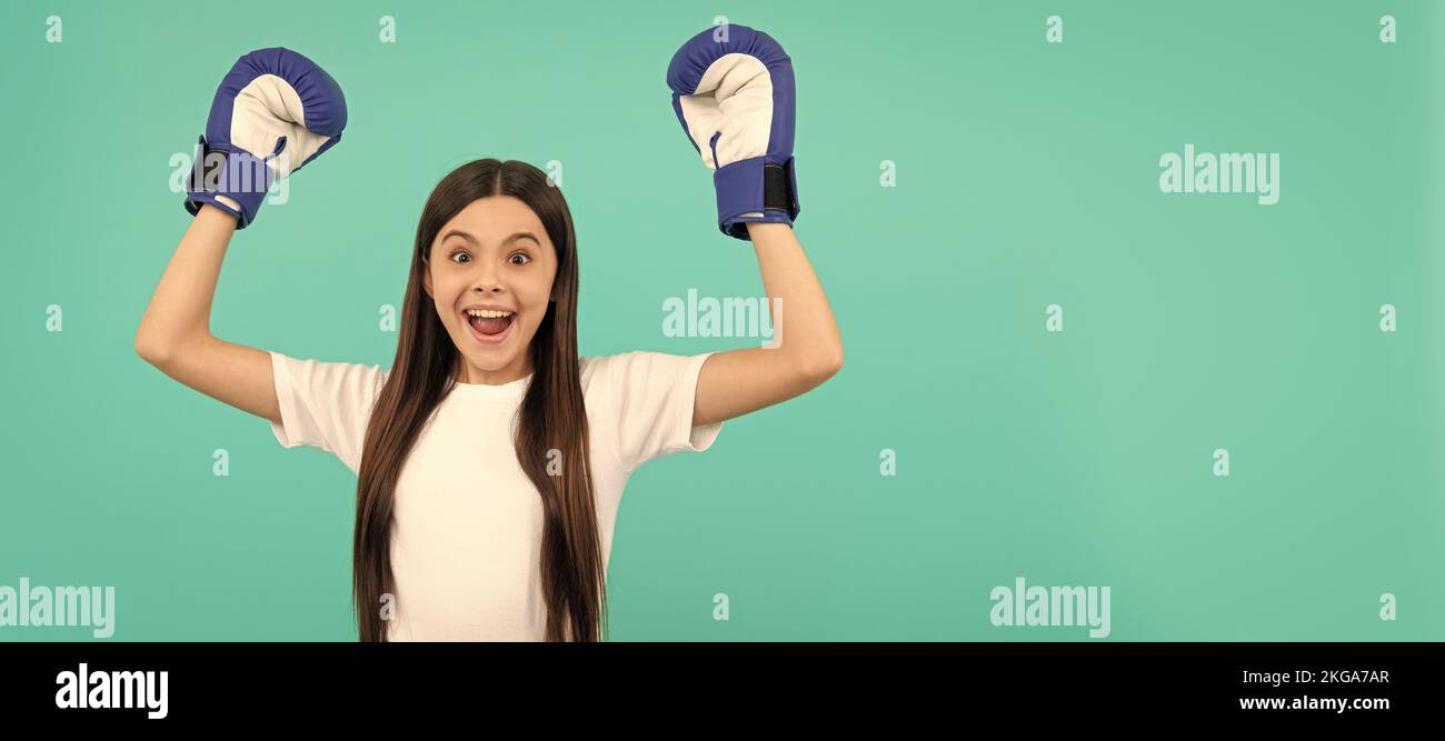 happy kid boxer celebrate victory in boxing gloves during sport ...