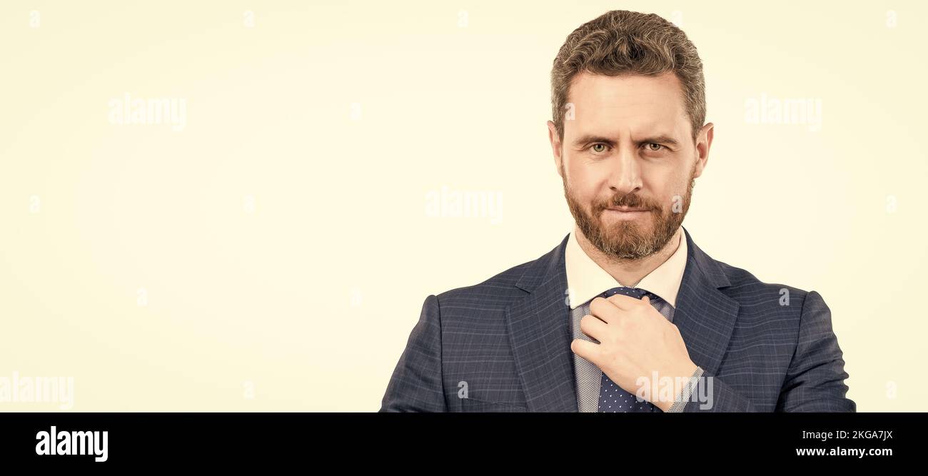 Portrait of professional man businessman with serious face adjusting ...