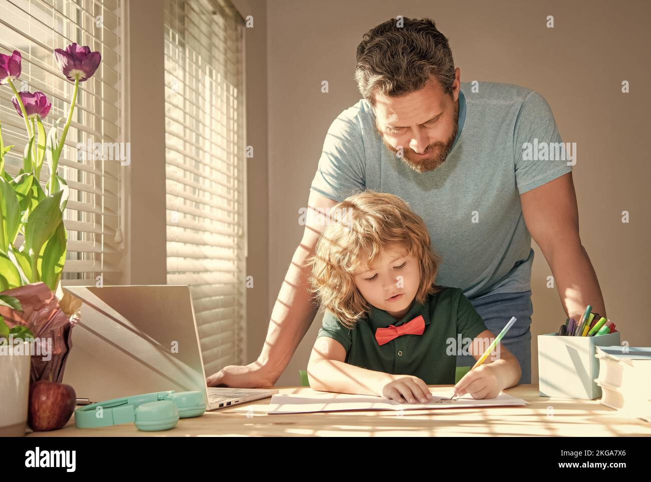 family and parenthood blog. boy do homework with private teacher ...