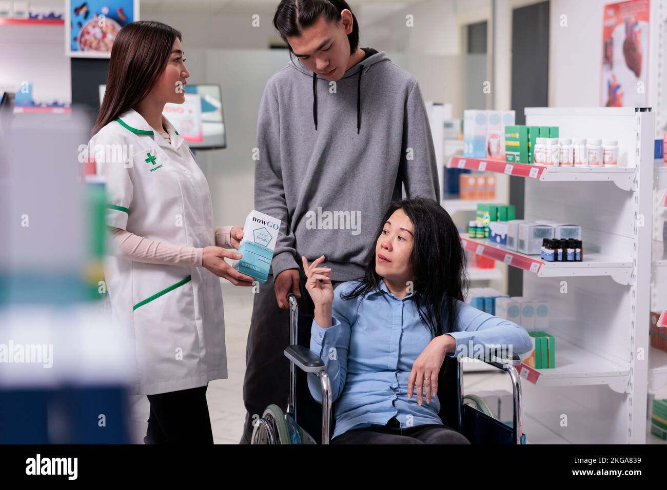 Client in wheelchair receiving help hi-res stock photography and images ...
