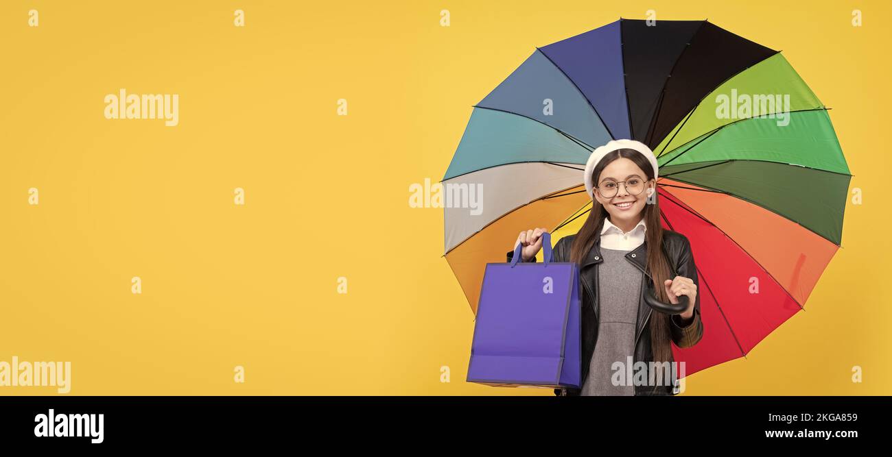 happy girl in glasses hold shopping bag. seasonal sale. teen kid under ...