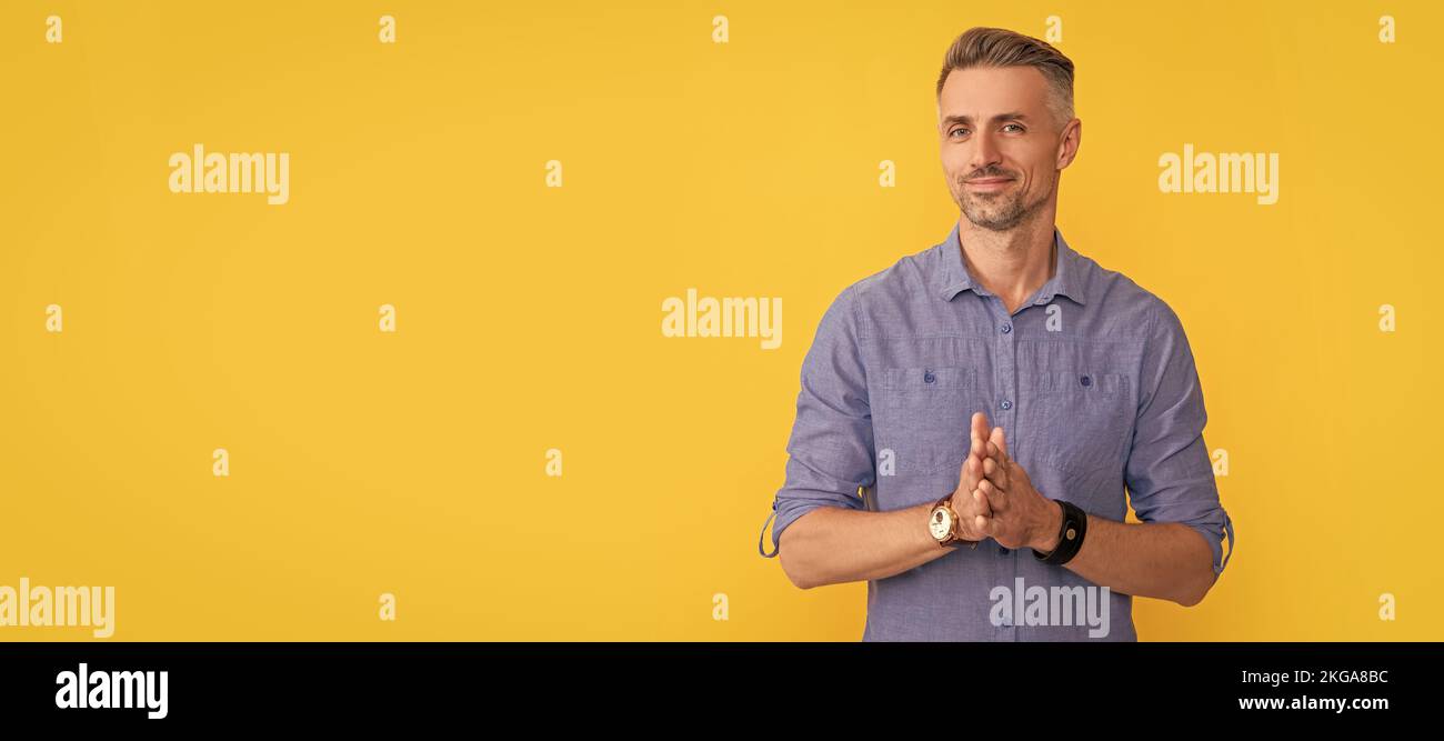 smiling man with wristwatch on yellow background, fashion accessory ...