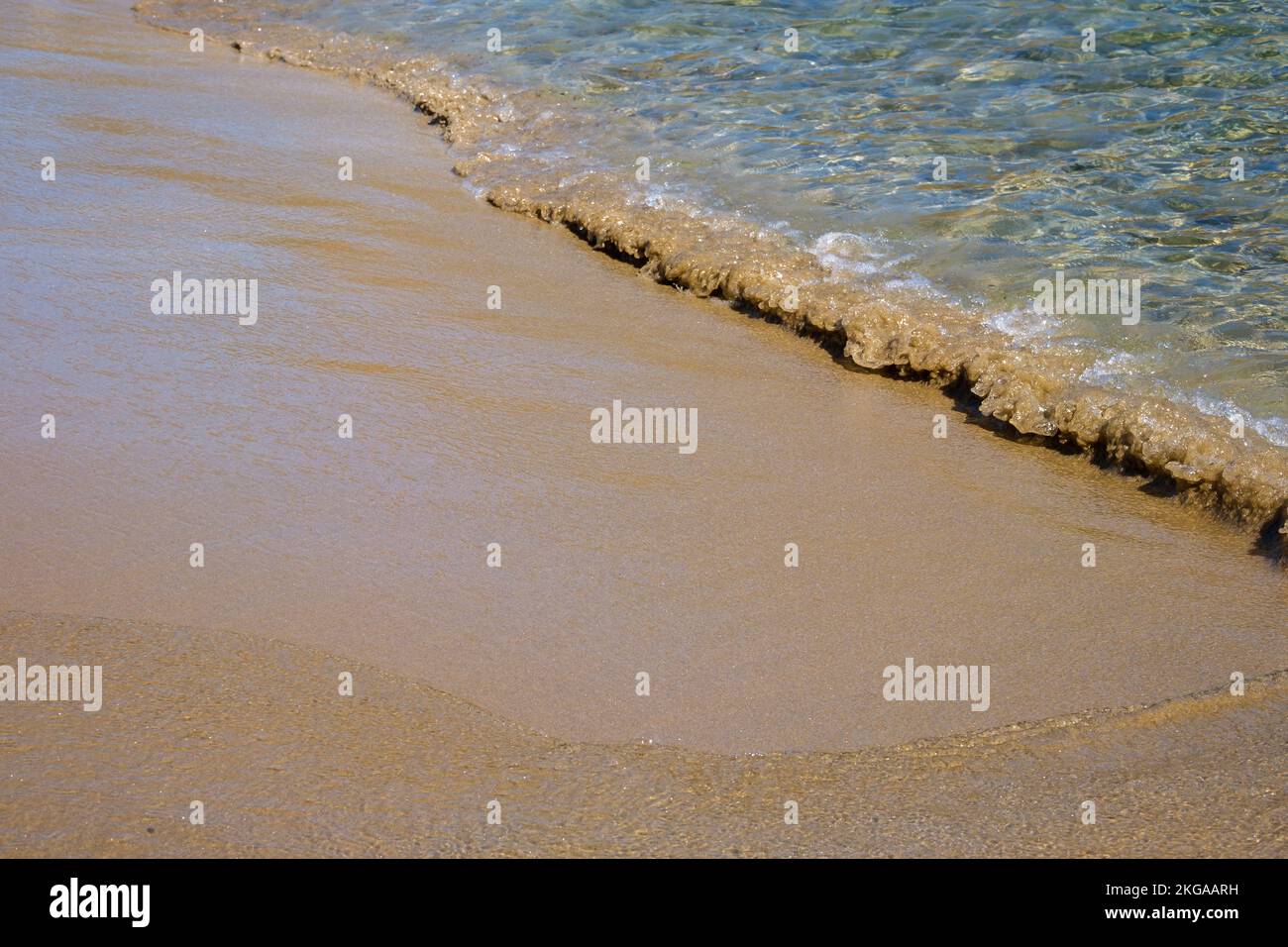 Close up of the beautiful sandy beach of Mylopotas in Ios Greece Stock ...