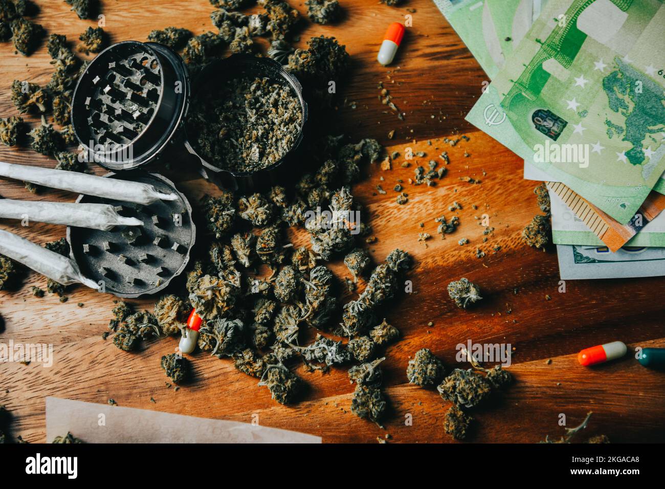 Marijuana buds with drugs, cbd and thc. Grinder and joints. Joint paper ...