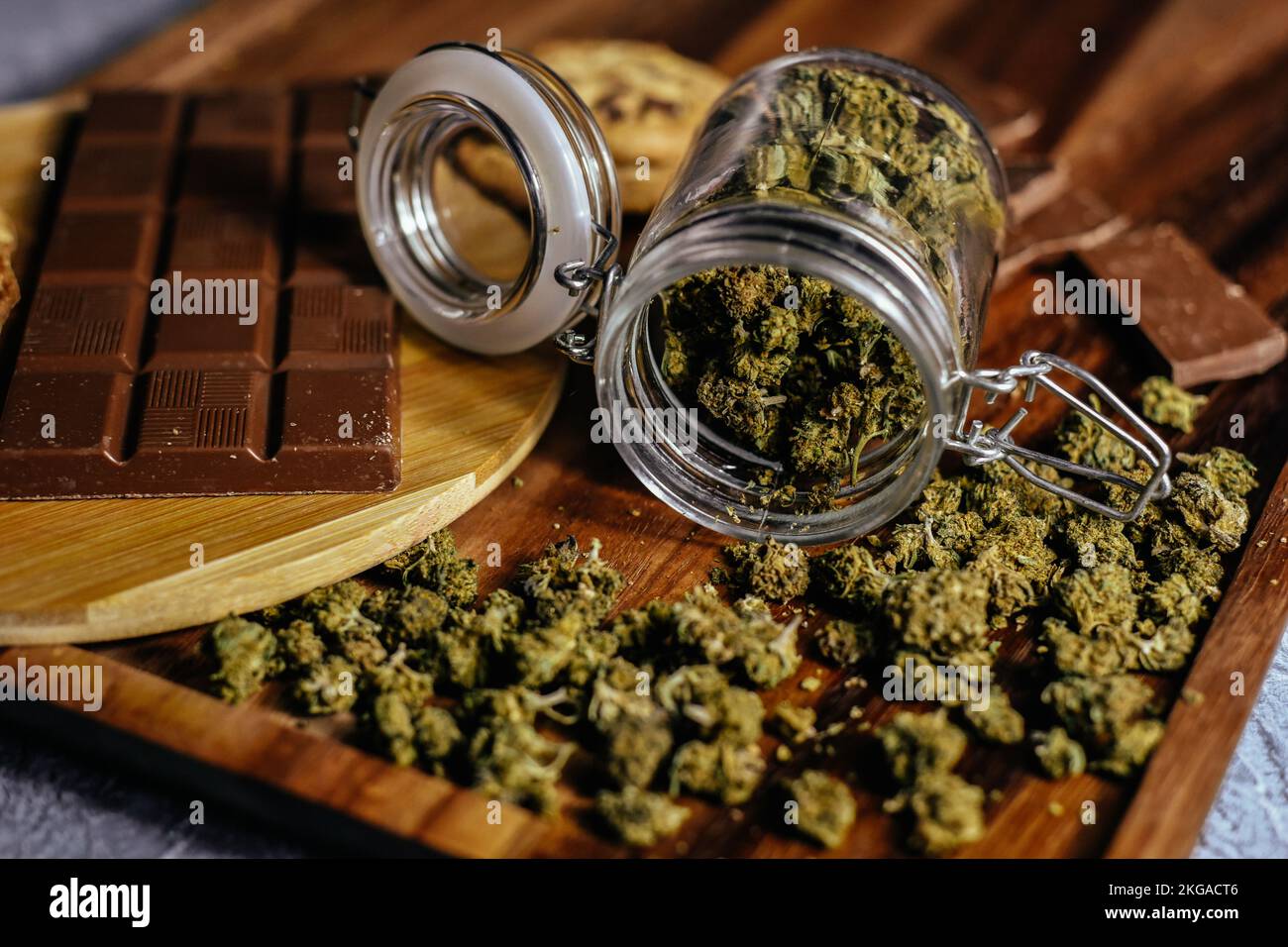 Chocolate and cookies with marijuana on a wooden table background ...