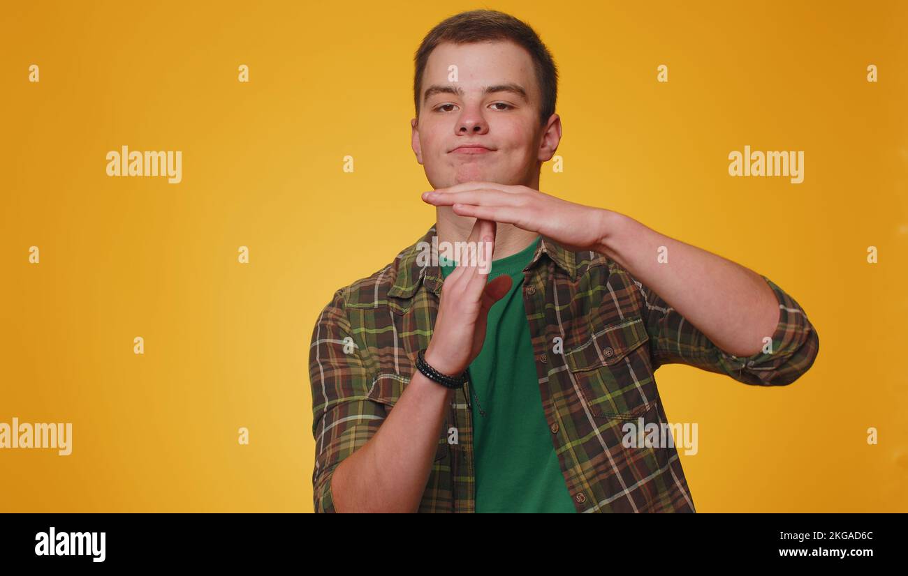 Tired serious upset man 20s in casual green shirt showing time out ...