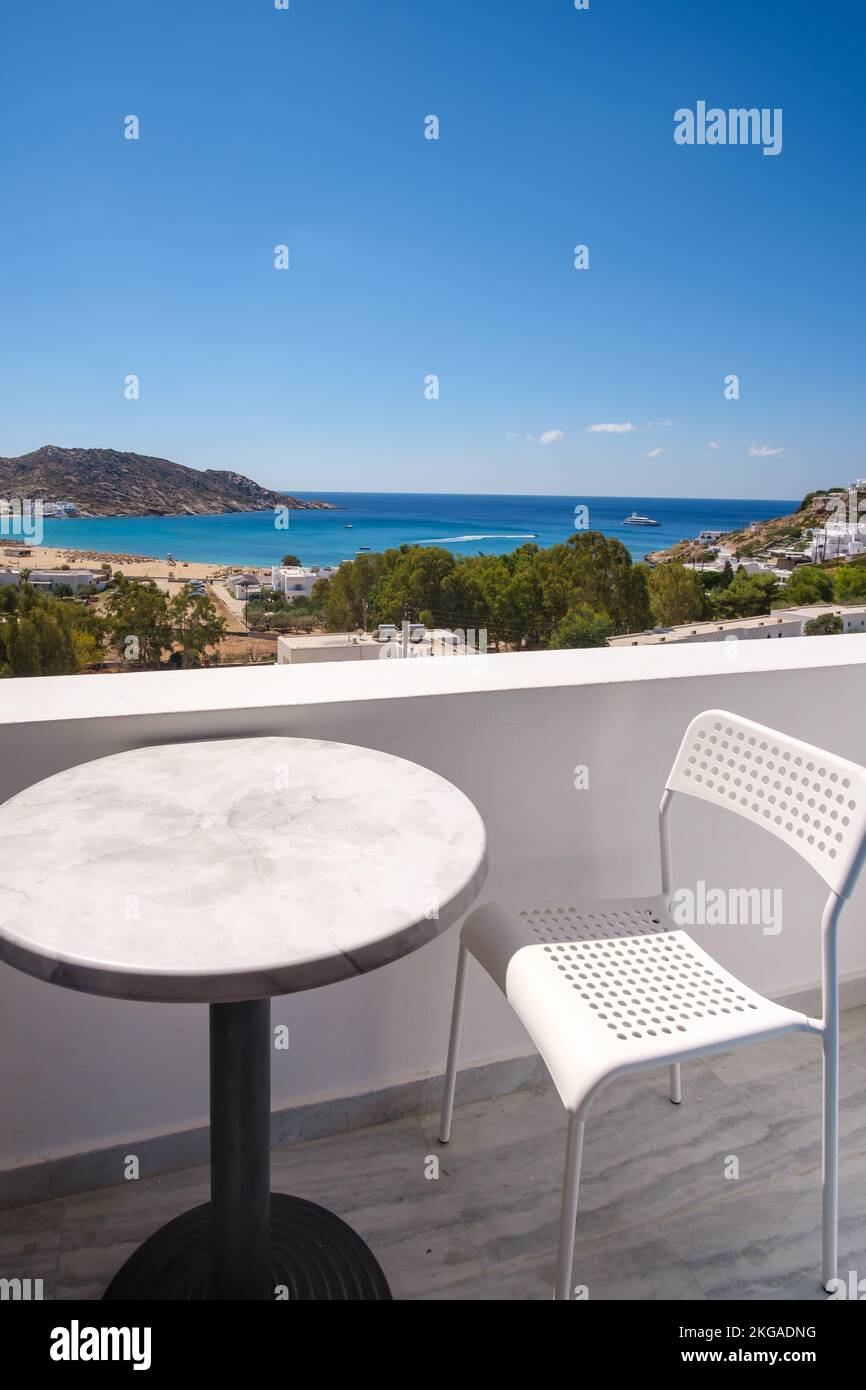 Amazing view from a balcony with a chair and a table overlooking the ...