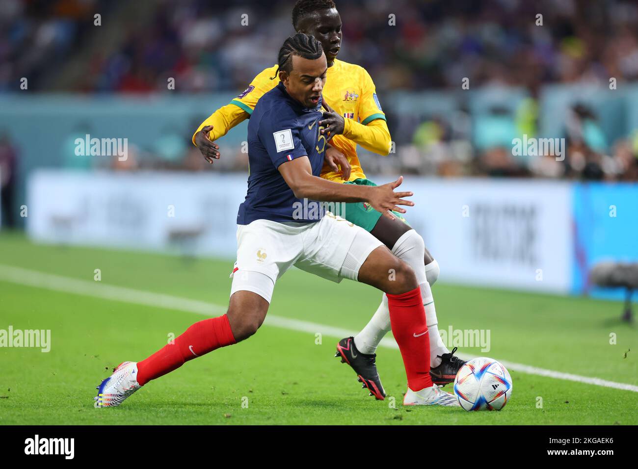 Al Wakrah, Qatar. 22nd Nov, 2022. (L to R) Jules Kounde (FRA), Garang ...