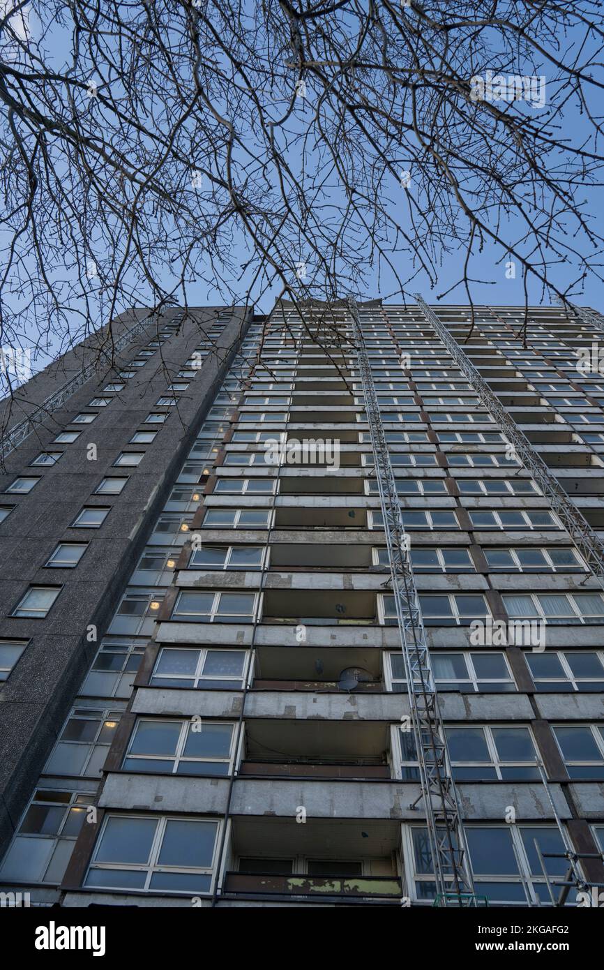 Run down abandoned social housing tower block awaiting re-development ...