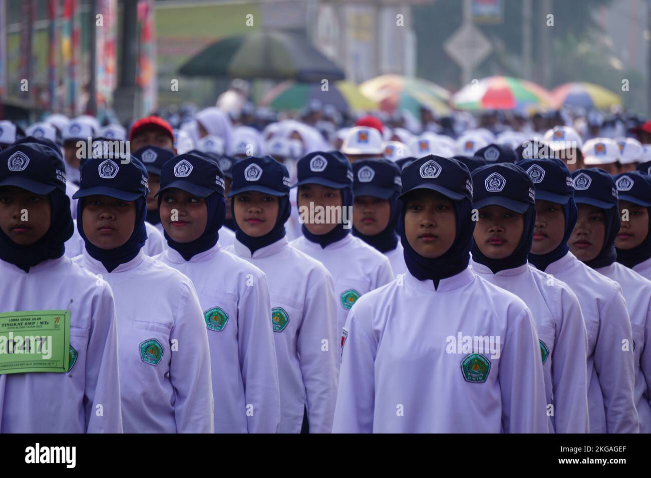 Indonesian junior high school students participating in marching (baris ...