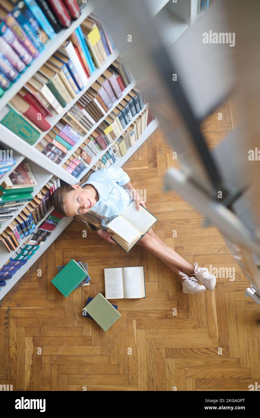 Top view of a girl in a school library Stock Photo - Alamy