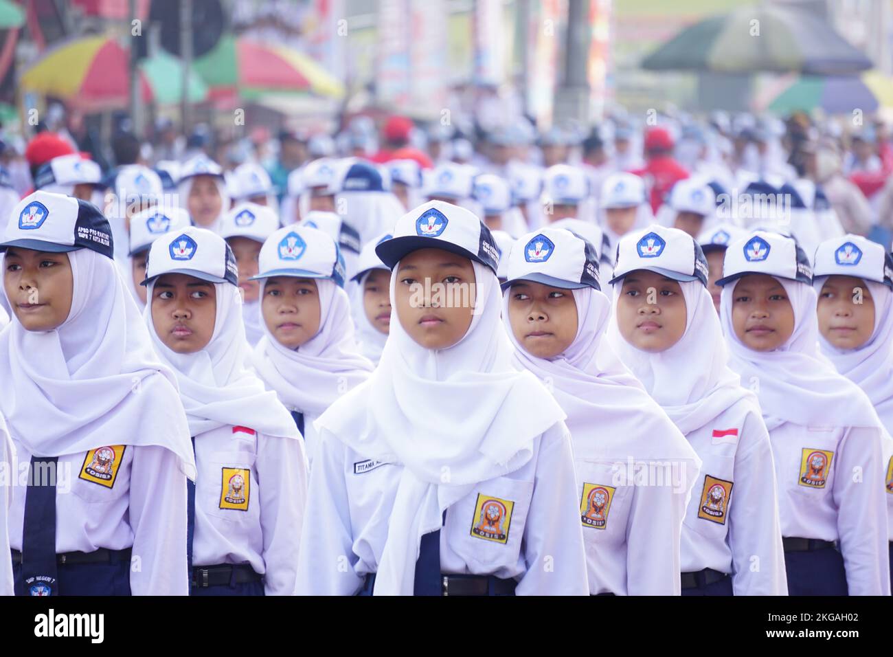 Indonesian junior high school students participating in marching (baris ...