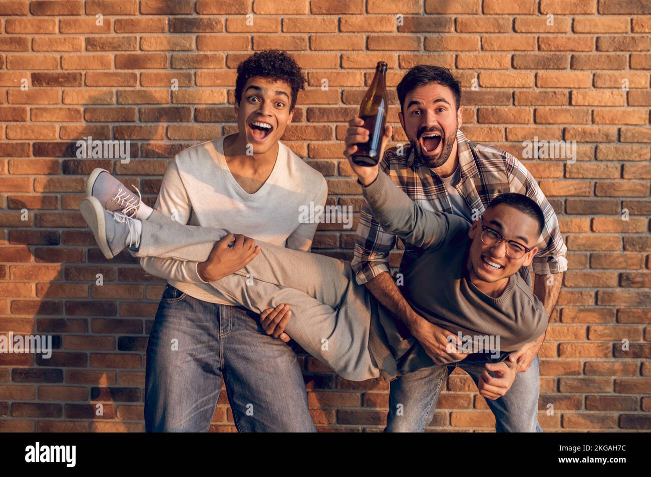 Cheerful company of friends having fun before the camera Stock Photo ...