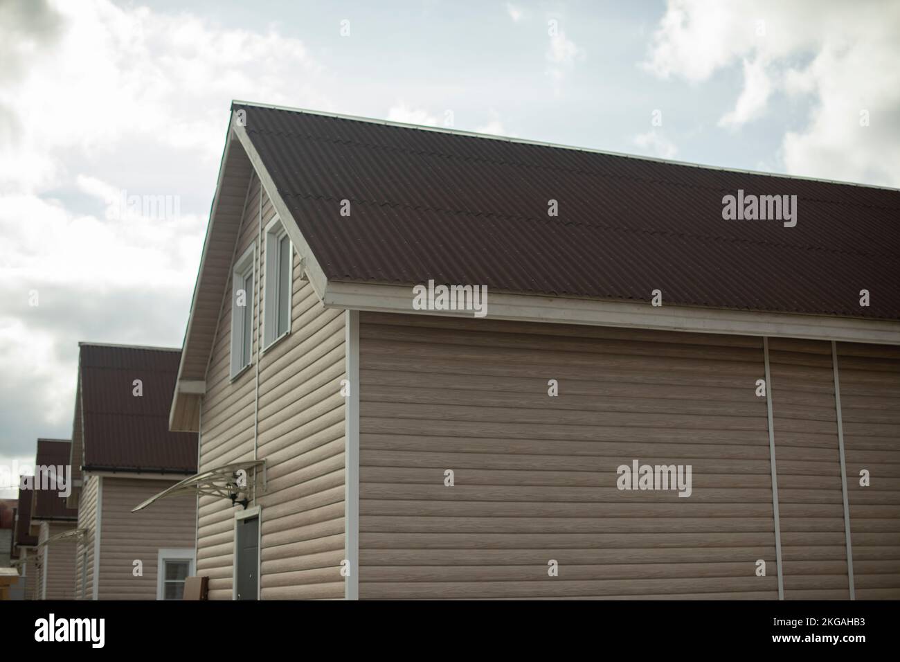 Country houses stand in row. Simple houses for living in countryside ...