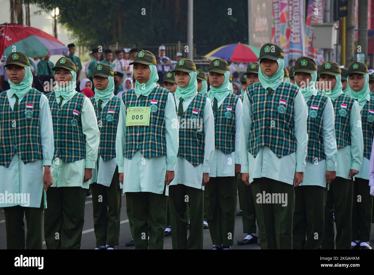 Indonesian junior high school students participating in marching (baris ...
