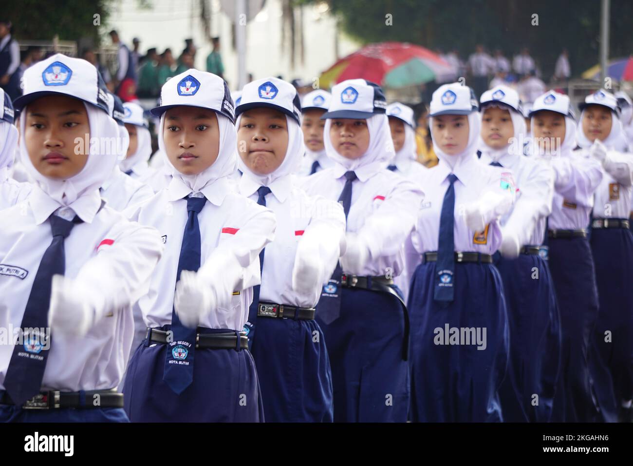 Indonesian junior high school students participating in marching (baris ...