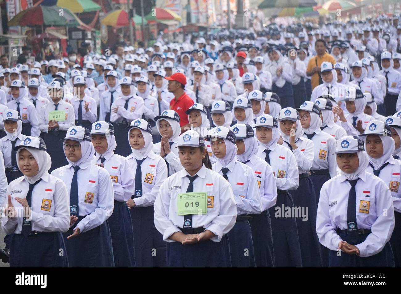 Indonesian junior high school students participating in marching (baris ...