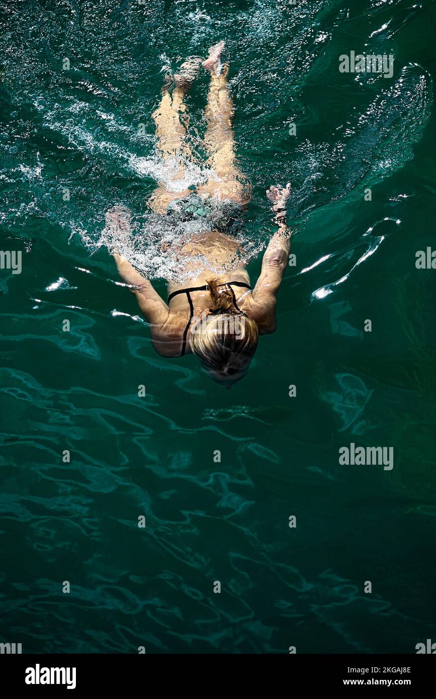 Swimming woman refresh in clear clean lake river water quality Stock ...