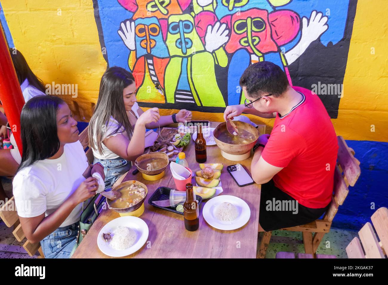 Group of friends eating typical Colombian food. Photo taken in ...