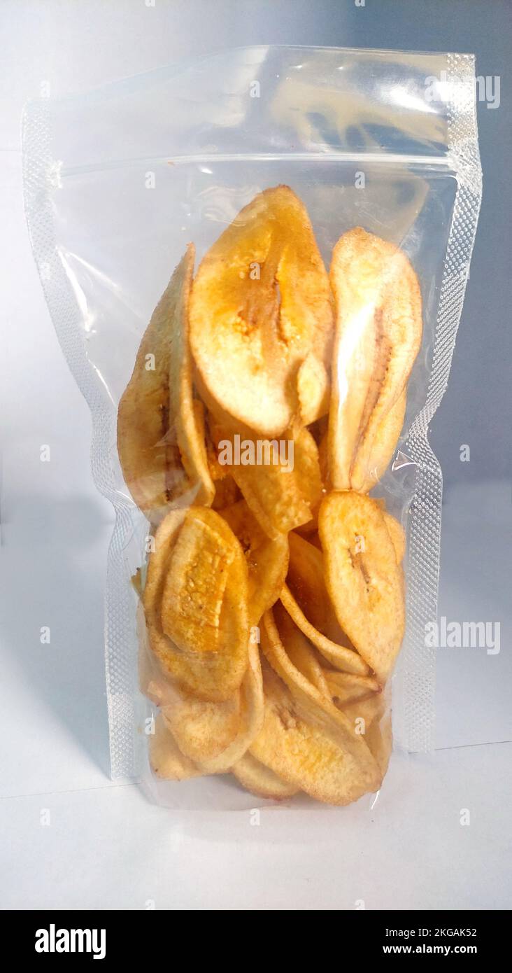 banana chips in plastic packaging ready for sale in white background ...