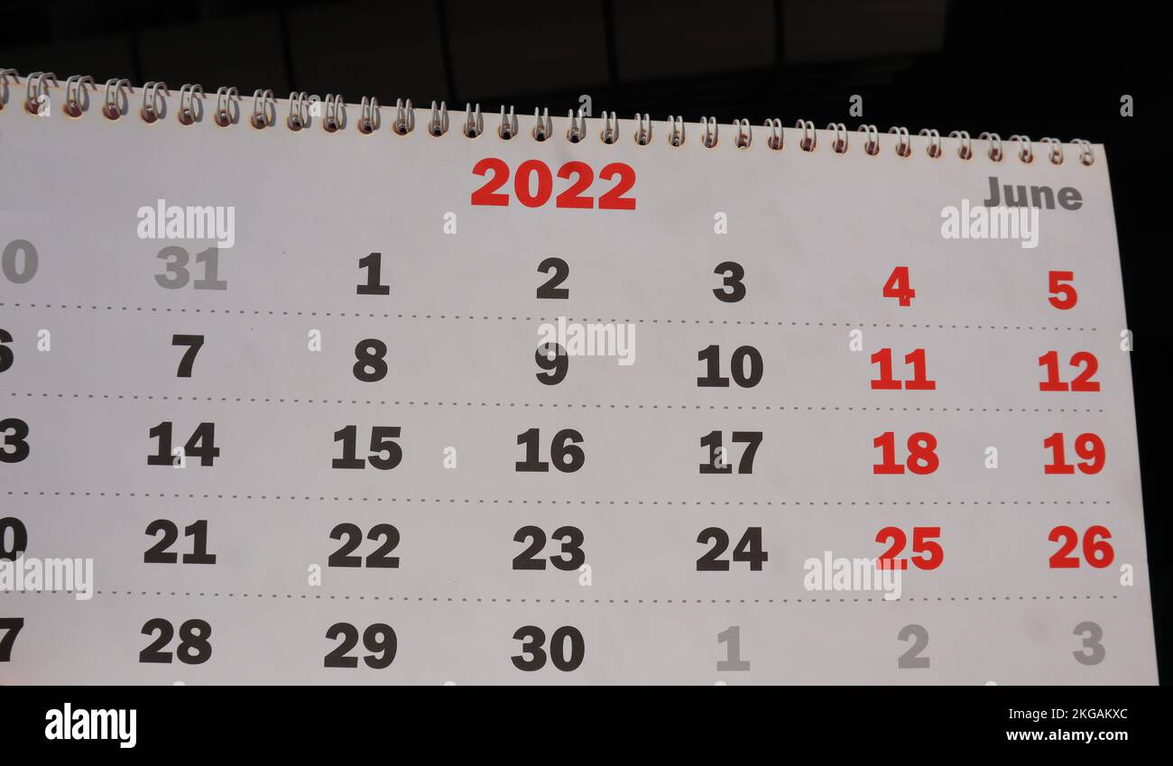 Close-up of a page of a paper calendar with a spiral for the month of ...