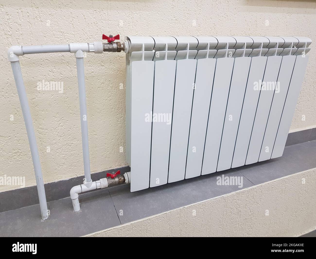 White modern aluminum radiator battery for hot water heating, on the ...