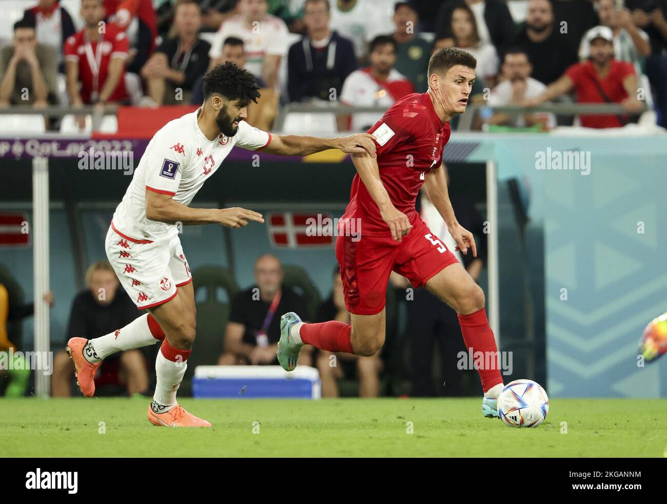 Joakim Maehle of Denmark, Ferjani Sassi of Tunisia (L) during the FIFA ...