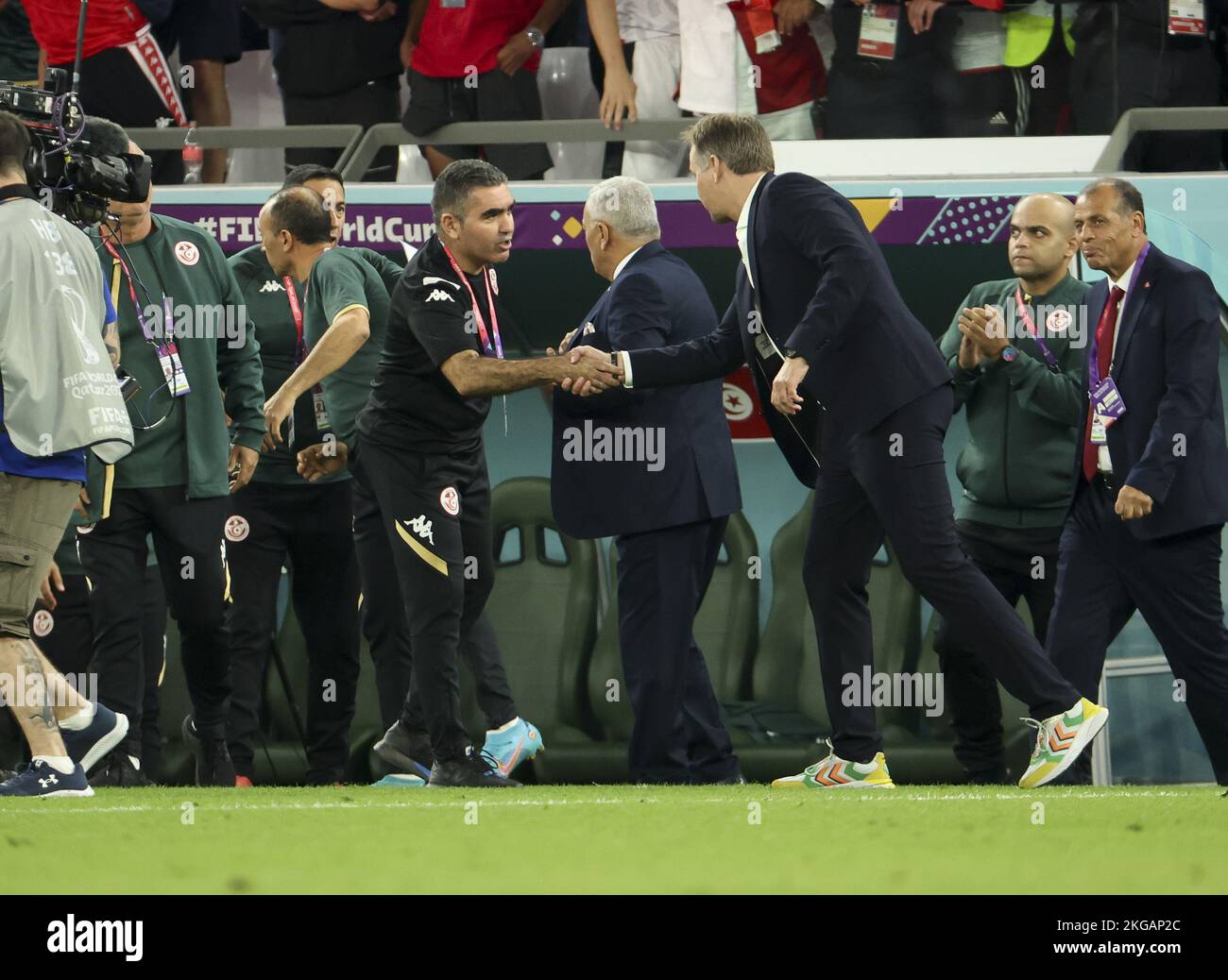 Tunisia head coach Jalel Kadri (L) and Denmark head coach Kasper ...