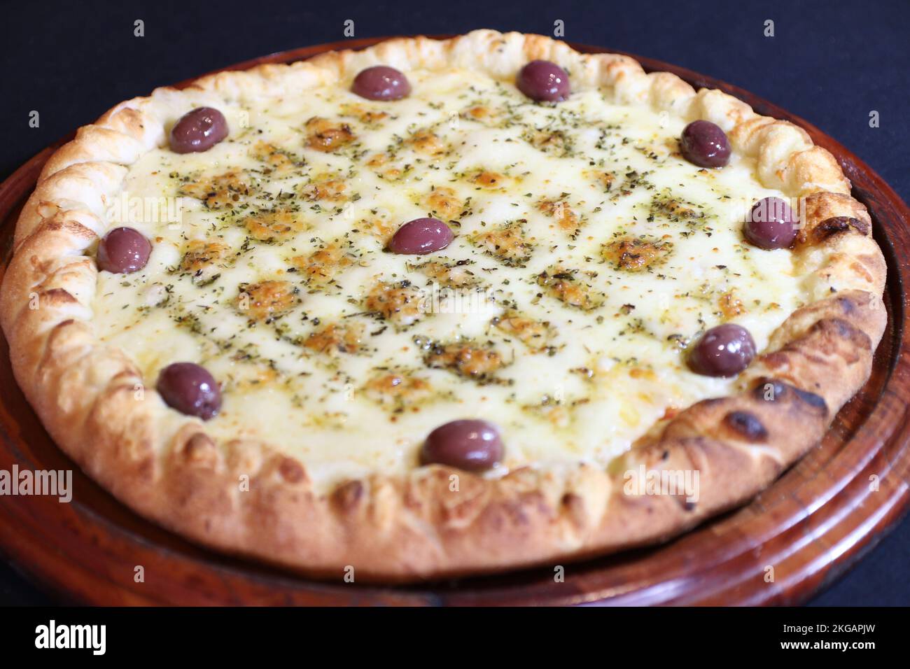 delicious pizza with lots of cheese Stock Photo - Alamy