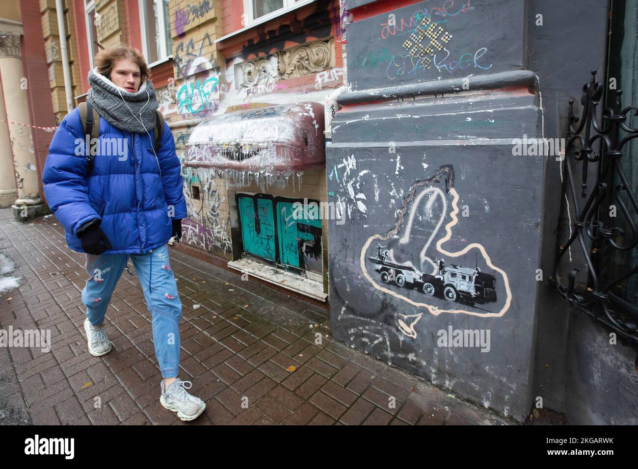 Kyiv, Ukraine. 22nd Nov, 2022. A man walks near the vandal-damaged ...