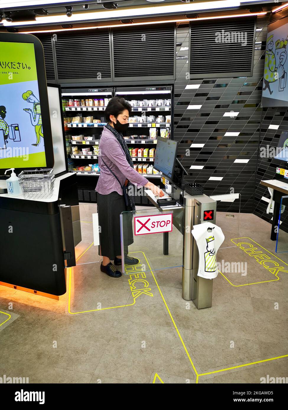 Editorial use only Woman paying for goods at a cashierless checkout in ...