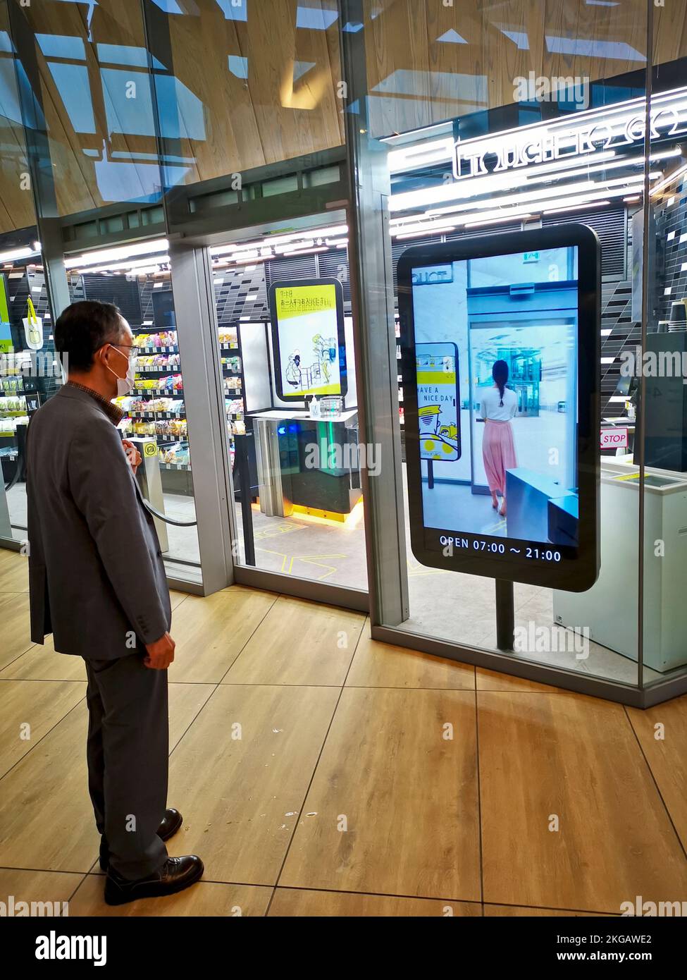 Editorial use only Man standing outside the entrance of an autonomous ...