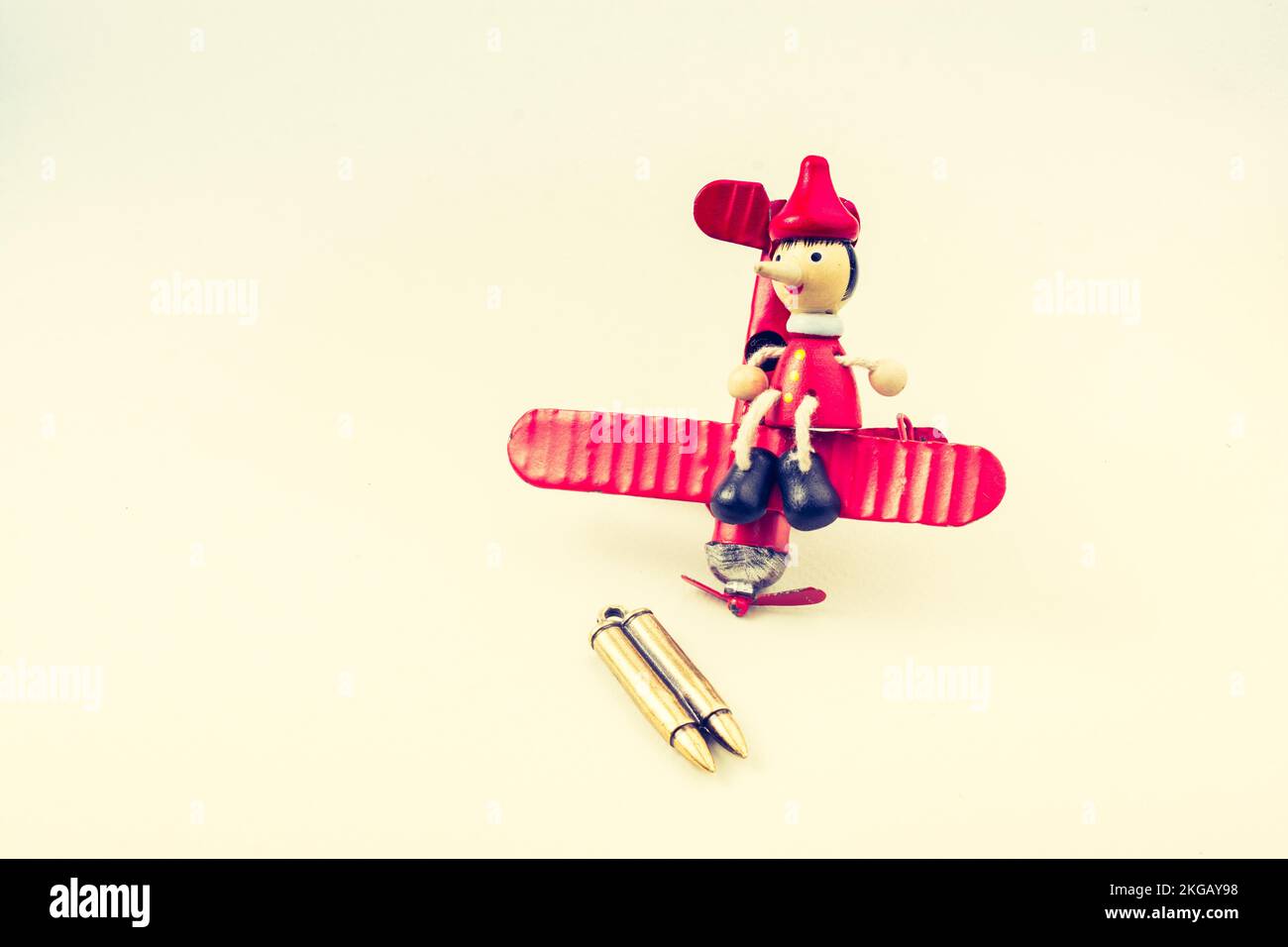 Airplane, Bullet and wooden pinocchio with his long nose Stock Photo ...