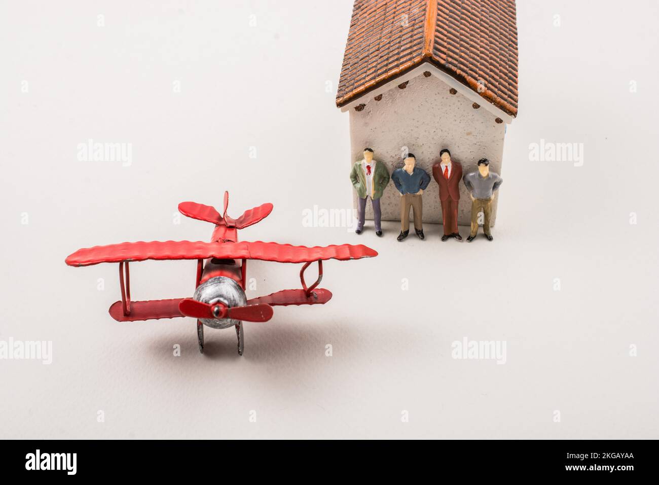 Airplane and tiny figurine of man miniature model in view Stock Photo ...