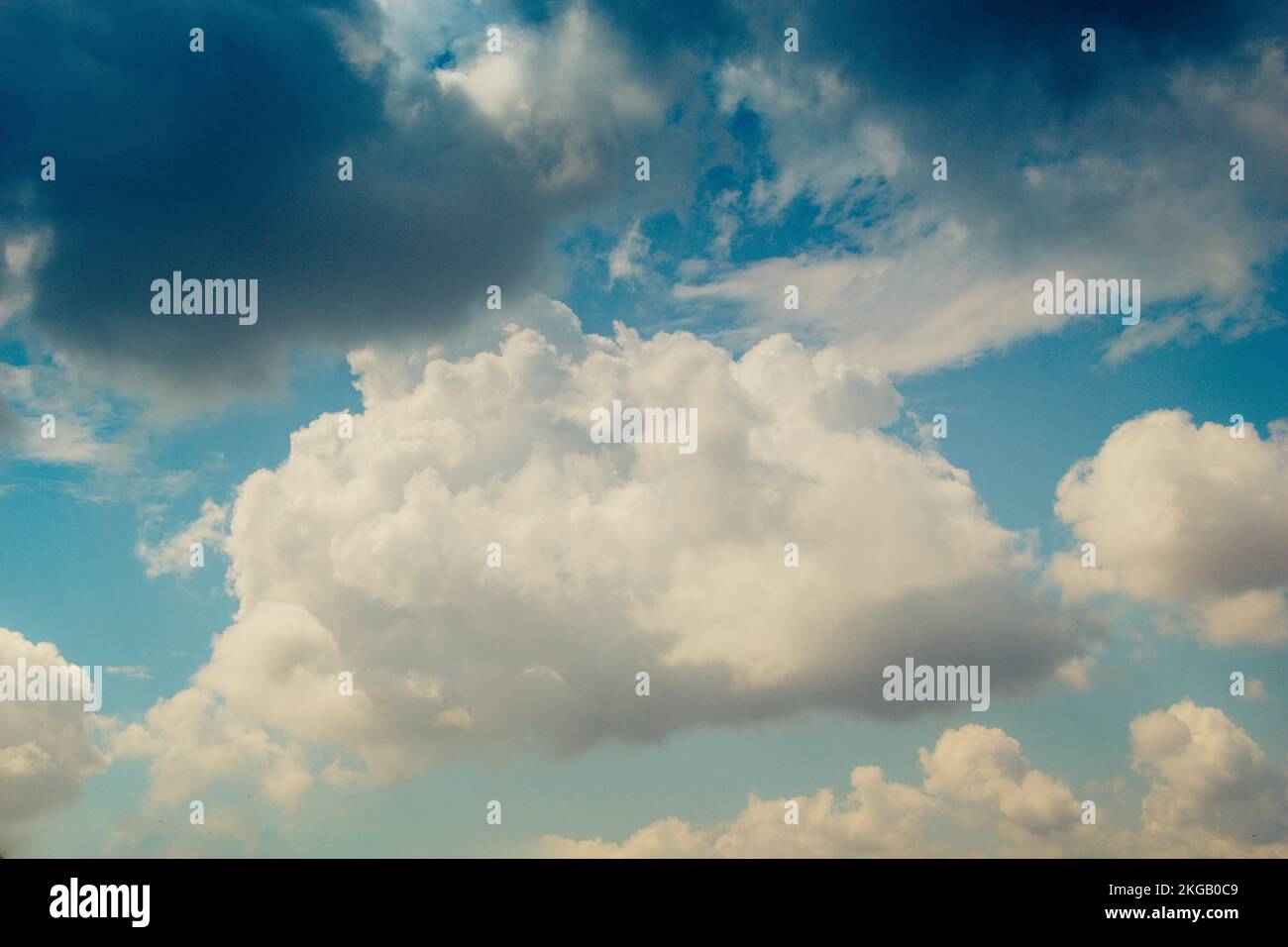 White color clouds cover the blue sky in the daytime Stock Photo - Alamy