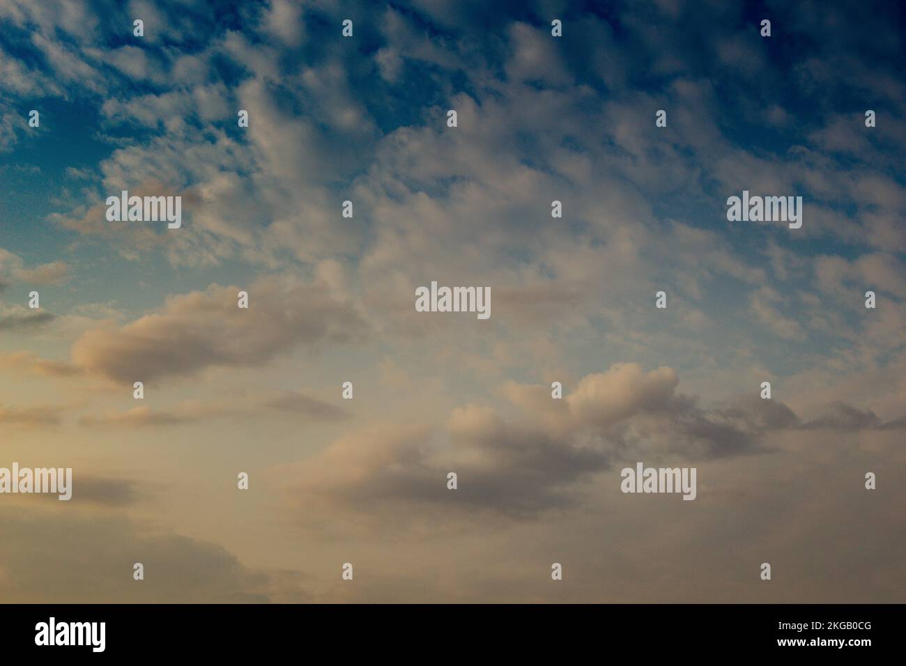 Grey color clouds partly cover the sky in the daytime Stock Photo - Alamy