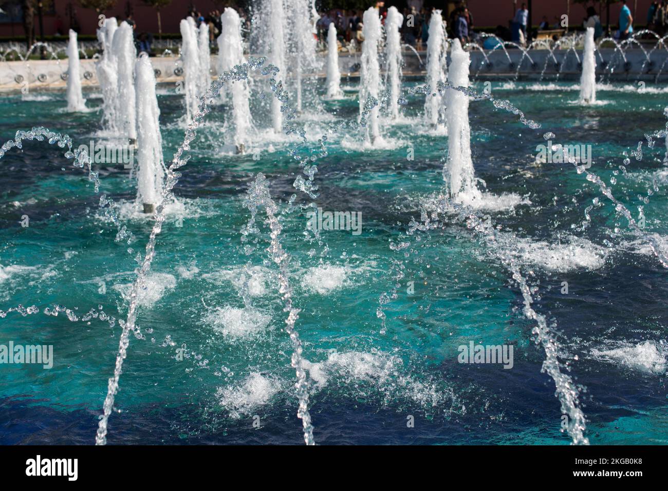 The fountains gushing sparkling water in a pool in a park Stock Photo ...