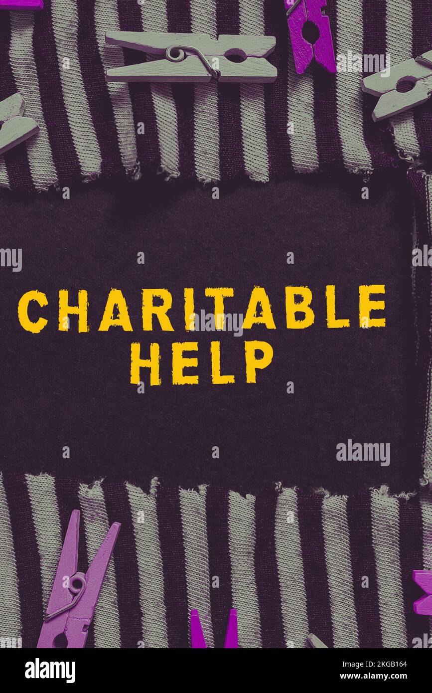 Hand writing sign Charitable Help. Internet Concept system of giving ...