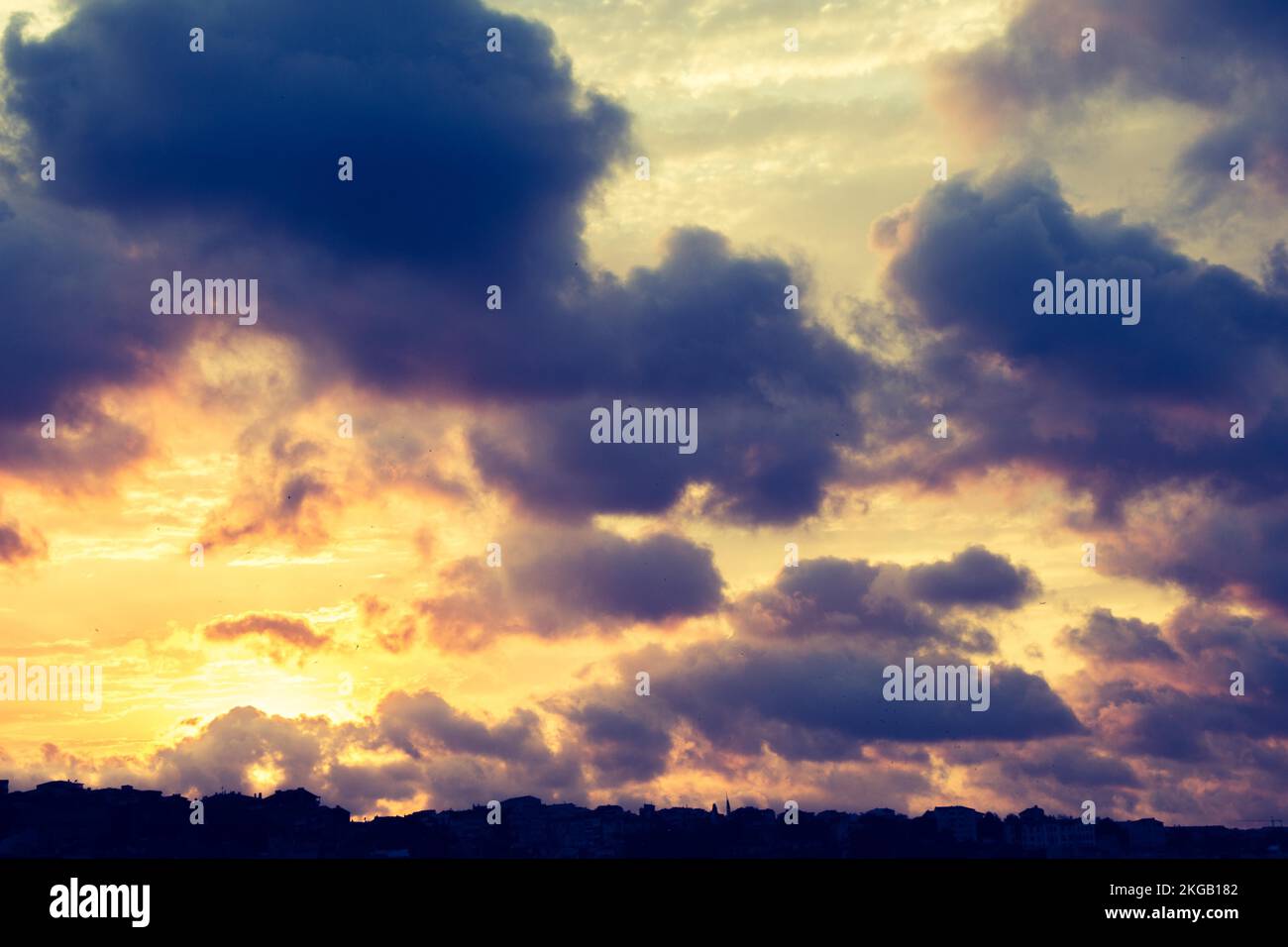 Grey color clouds partly cover the sky in the daytime Stock Photo - Alamy