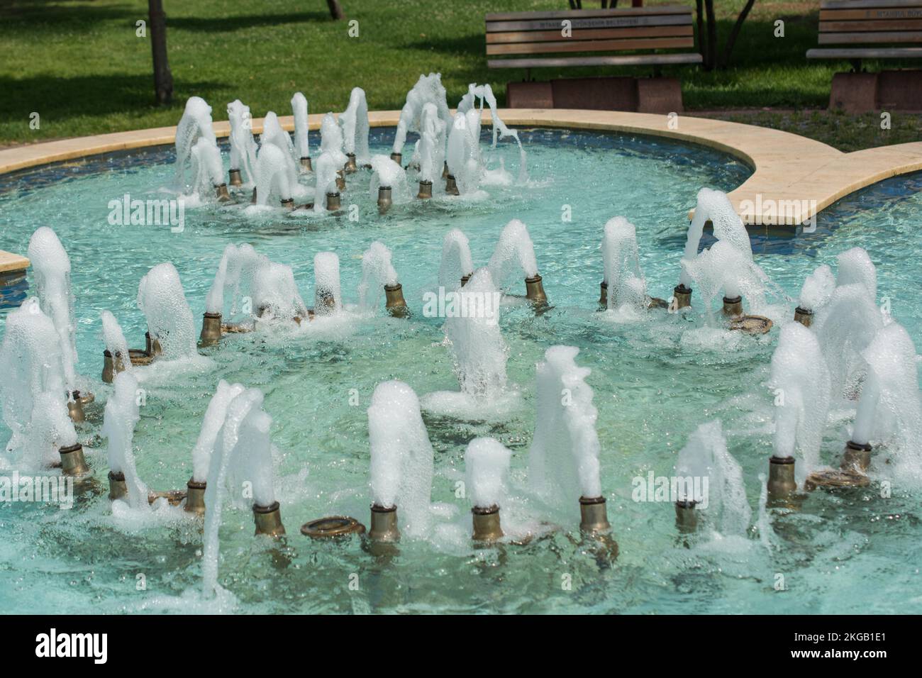 The fountains gushing sparkling water in a pool in a park Stock Photo ...