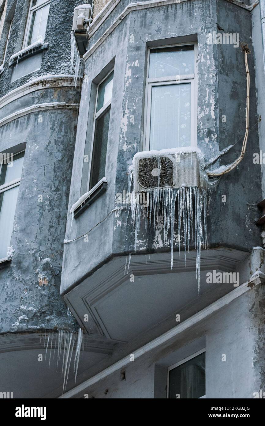 Frozen air conditioner with icicles hanging above the street Stock ...