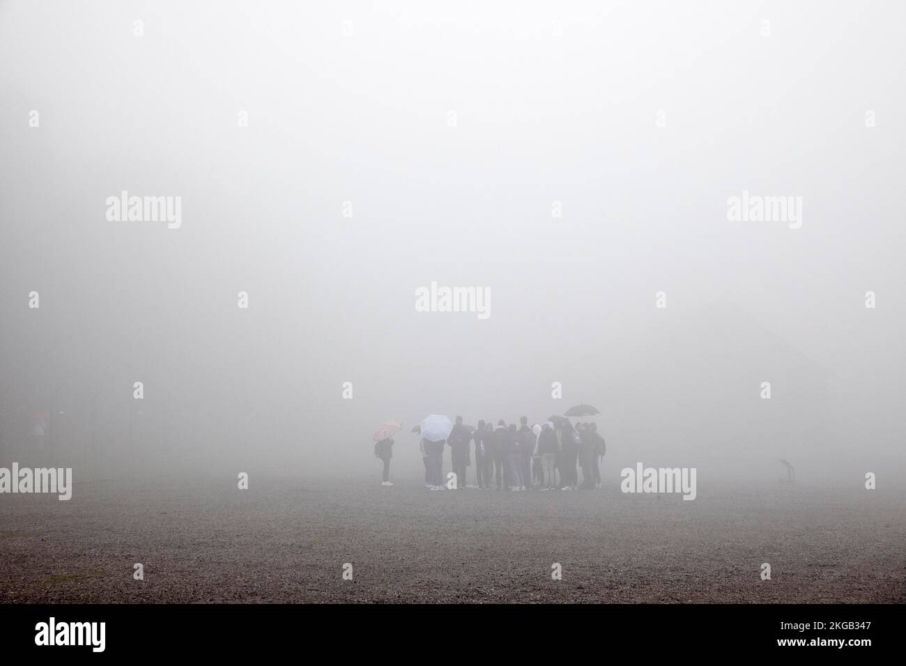 Group of visitors in the fog at beech forest concentration camp, now a ...