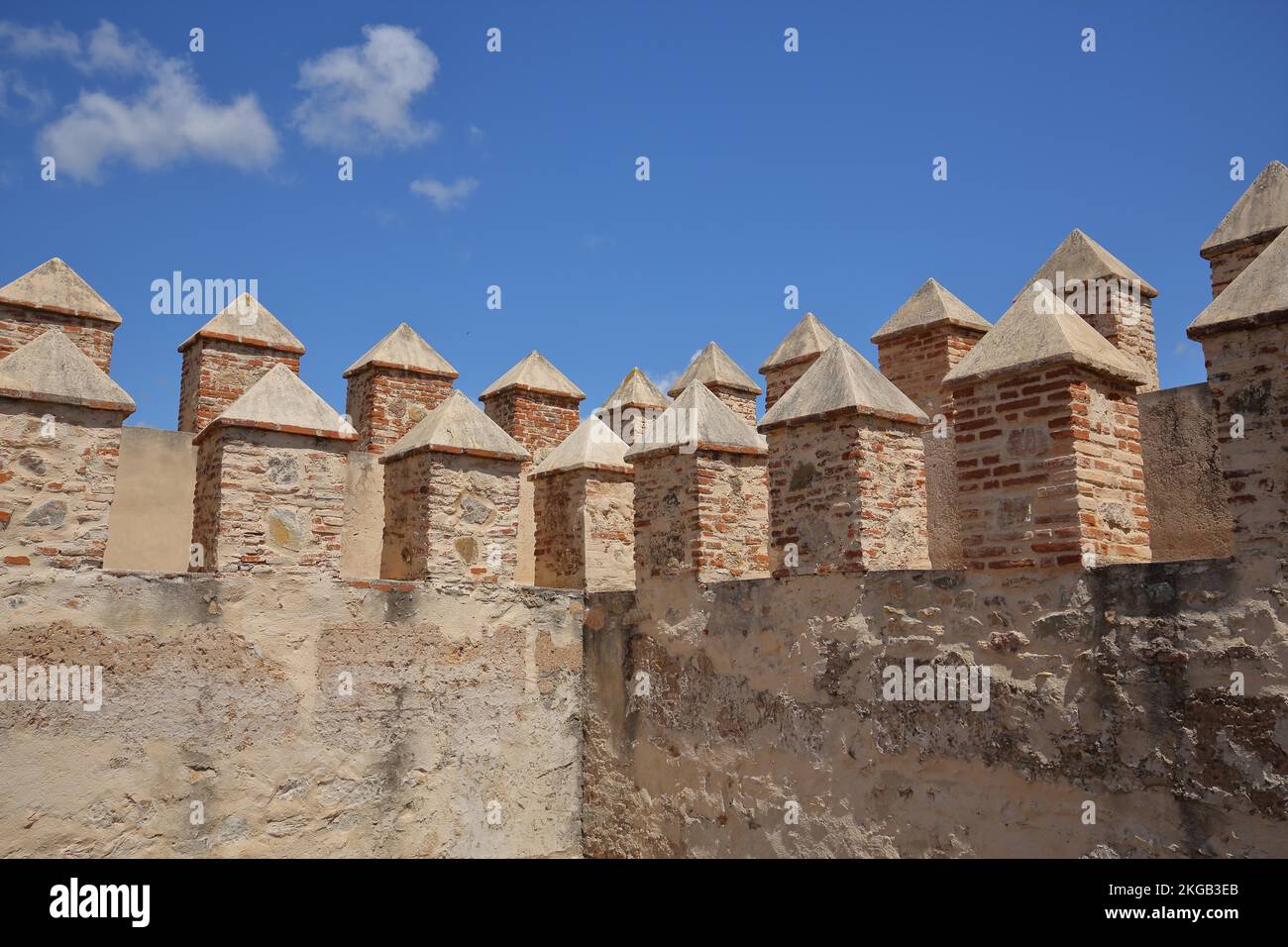 Detail with palisades at the city fortification Alcazaba in Badajoz ...