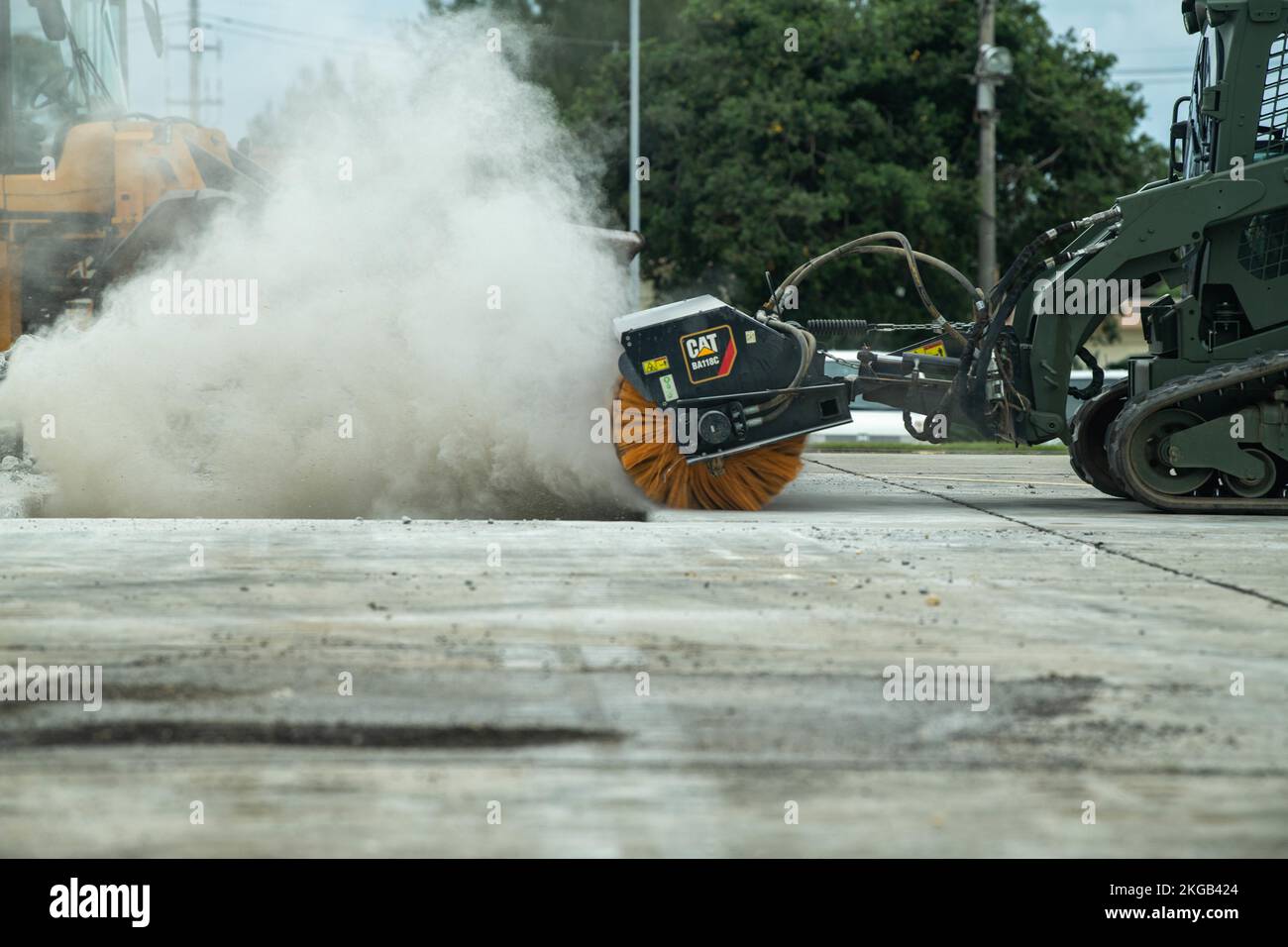 A sweeper is used to clean up a crater site during a joint airfield ...