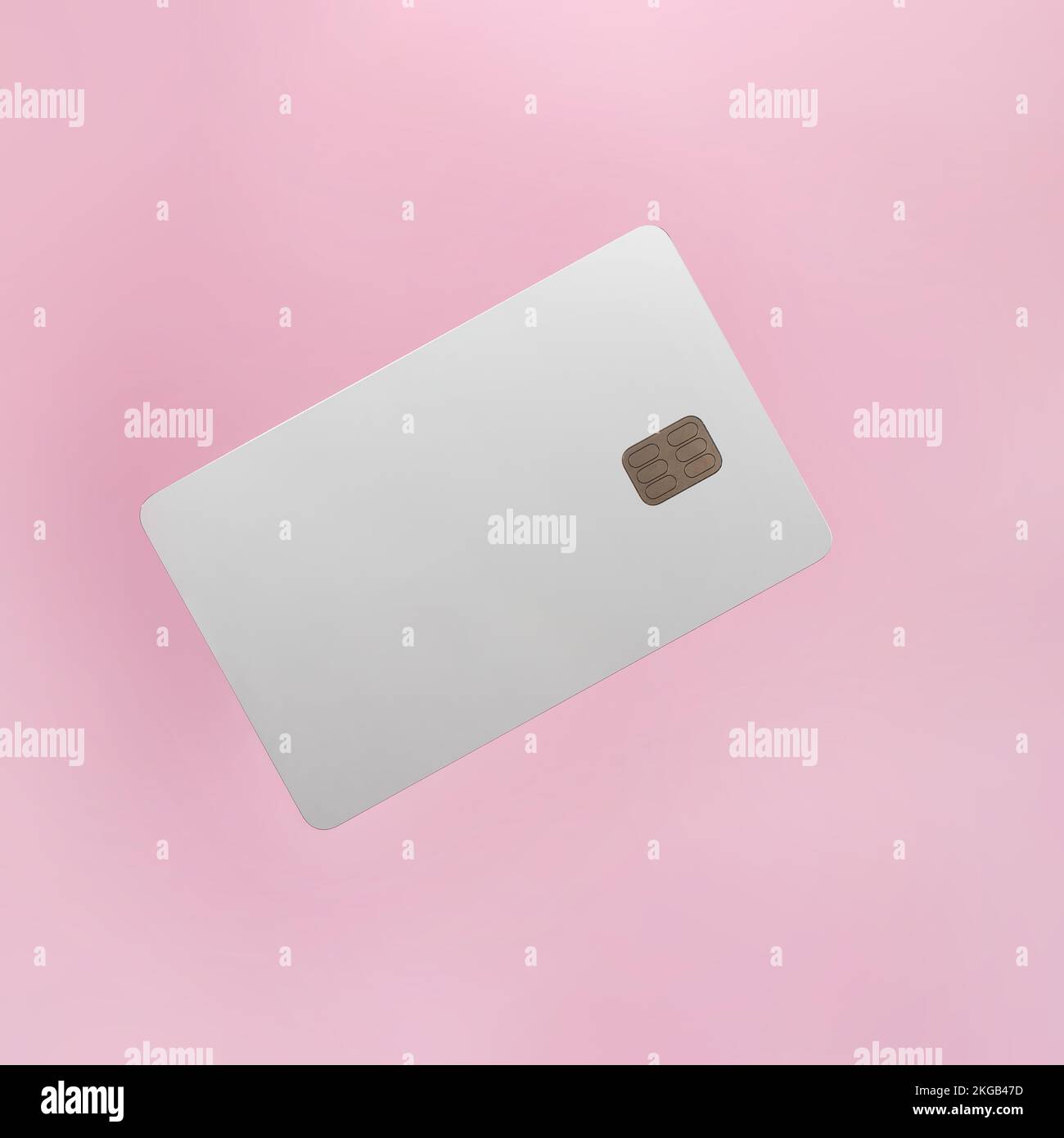 White credit card with chip levitating in the air over the pink ...